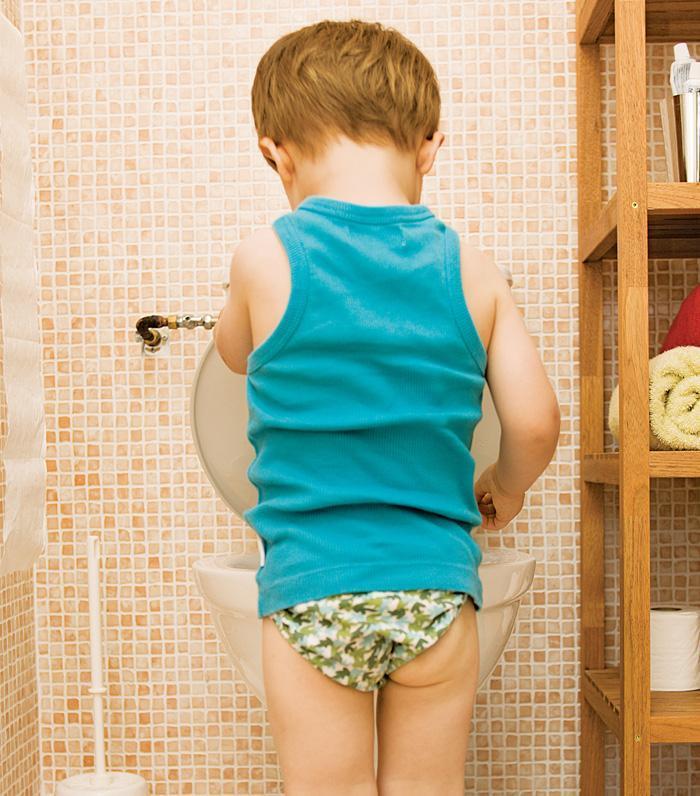 boy standing up peeing
